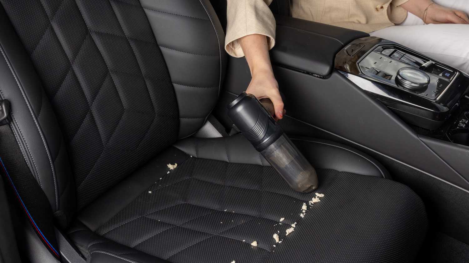 This handheld car vacuum made my travel cleaning a breeze